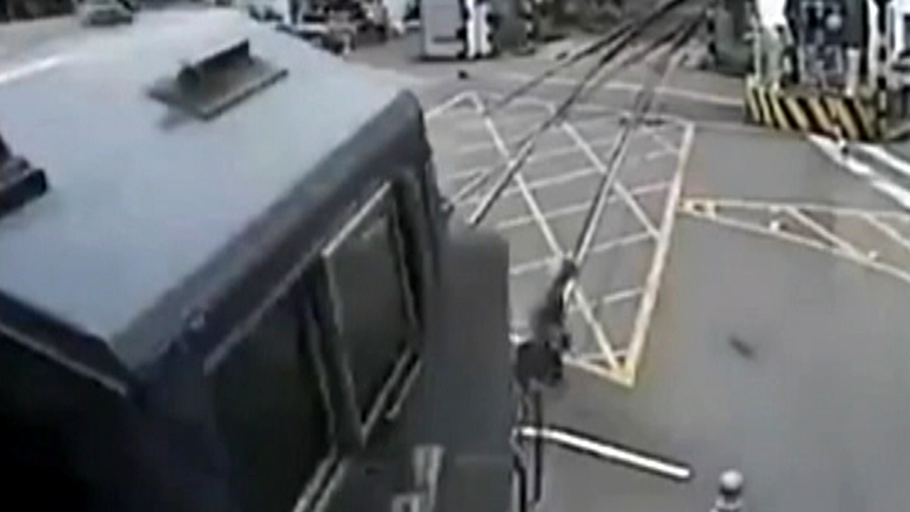 Oblivious man crossing train tracks escapes death by inches | Fox News ...