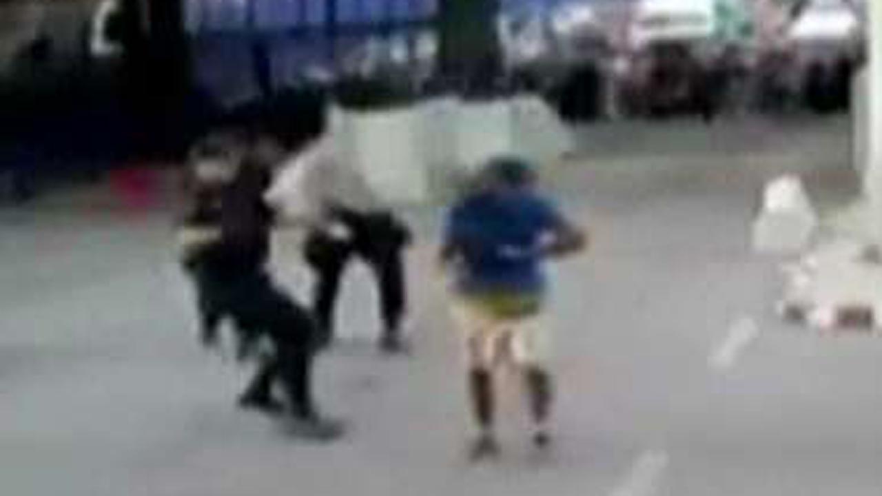 Cop takes out knife-wielding man with traffic barrier | Fox News Video
